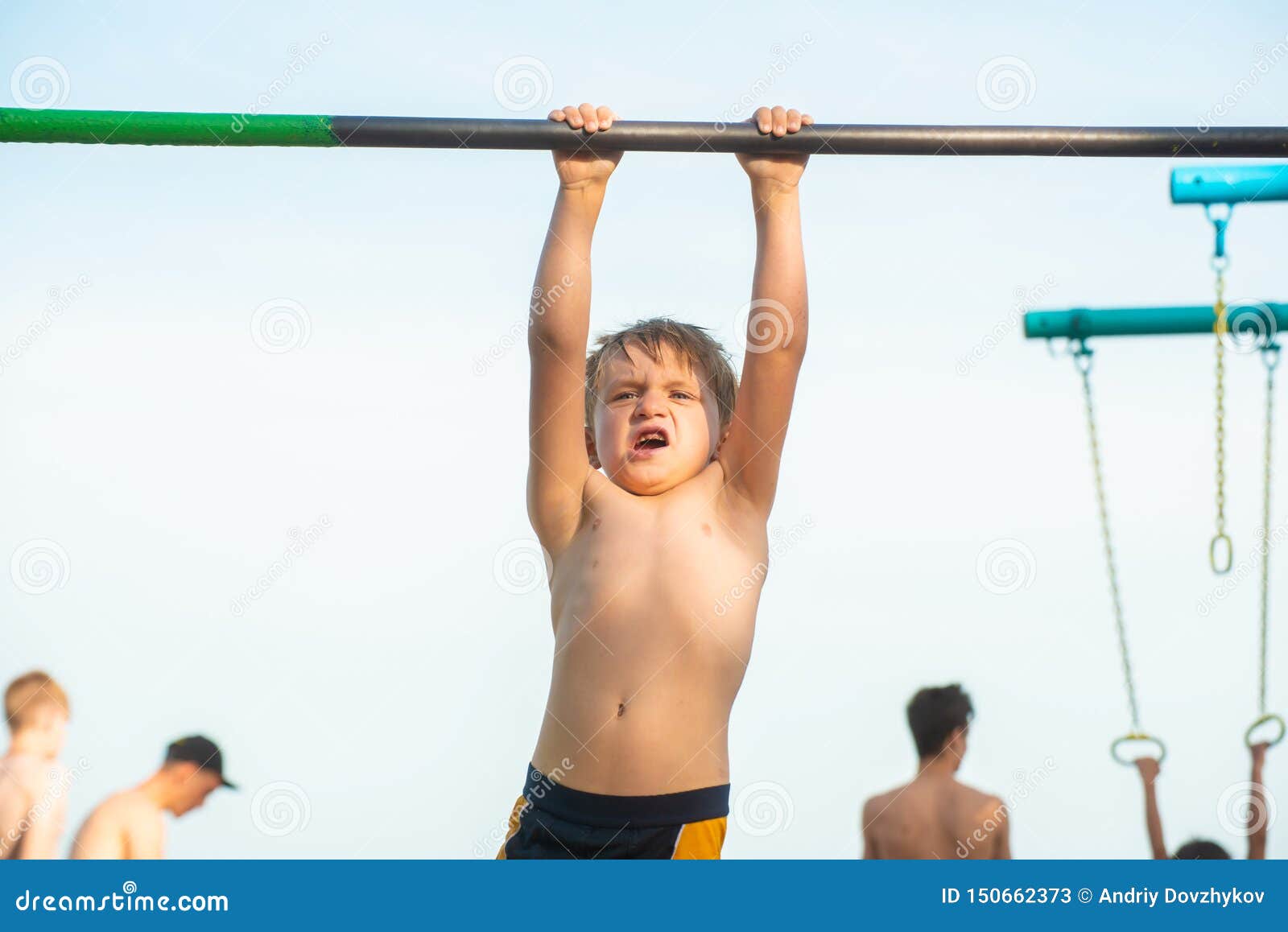 A Little Boy is Hanging on the Horizontal Bar and Can Not Do Anything ...