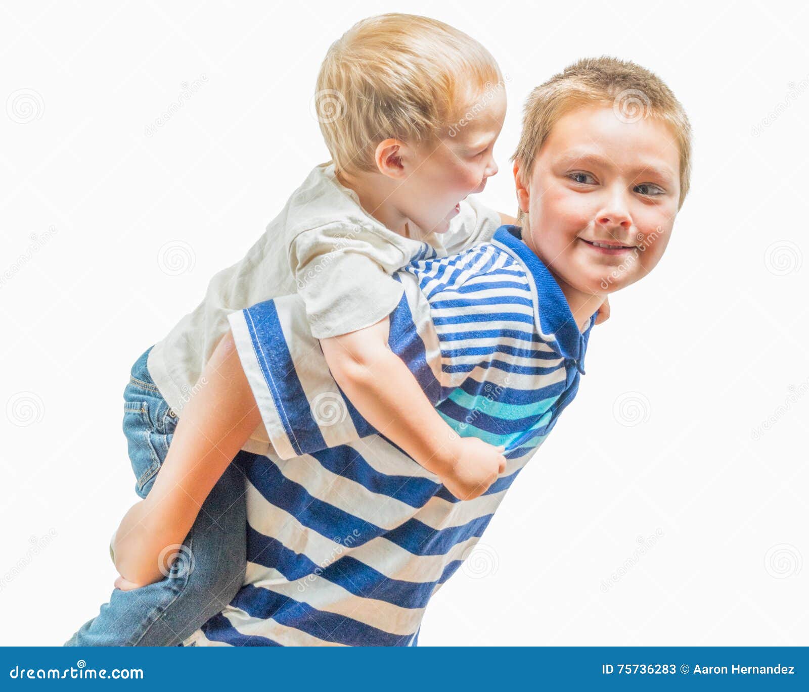 Little Boy Has Fun Riding on Responsible Older Boys Back Stock Image ...