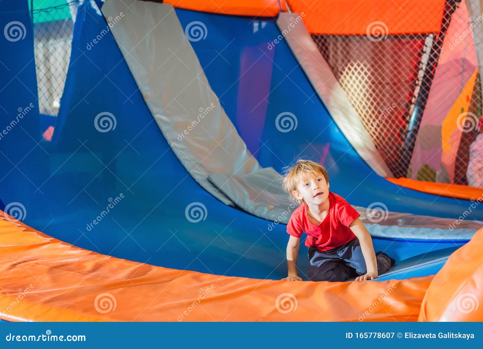 Little Boy Have Fun Jumping on Trampolines Stock Image - Image of ...