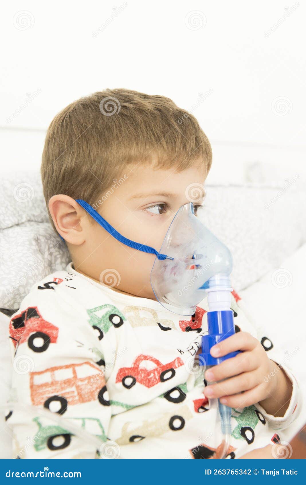 Sick boy with an inhaler stock photo. Image of inhaler - 263765342