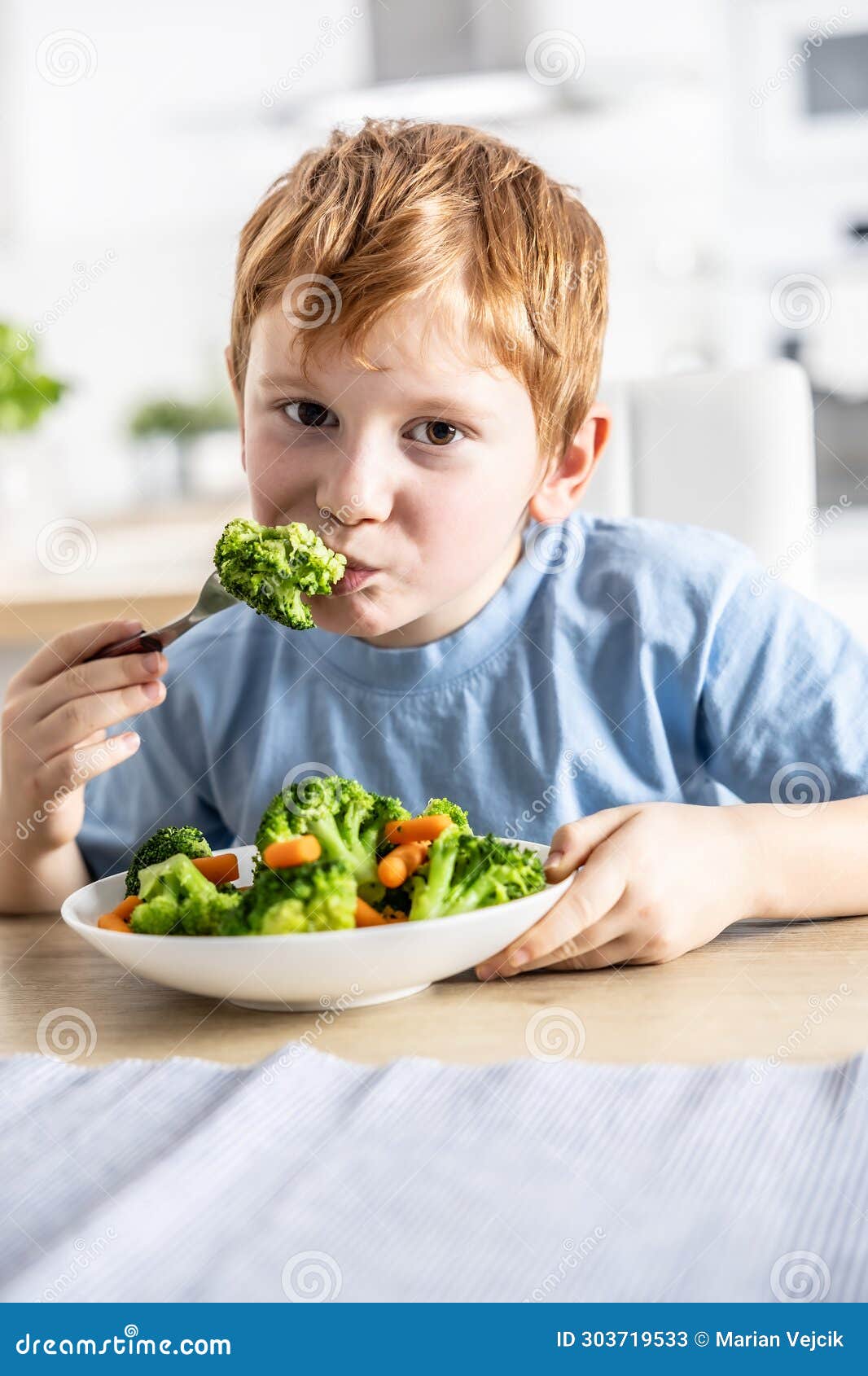 A Little Boy is Having Lunch and Eating Broccoli Stock Image - Image of ...