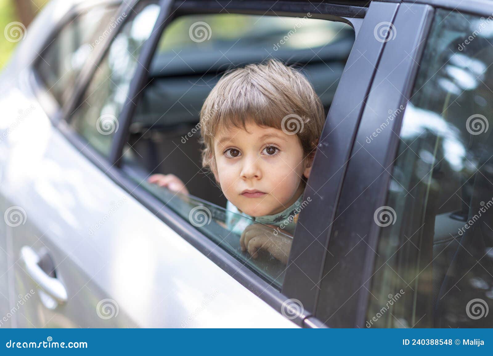 Little Boy with Head Leaned through the Open Window of a Car Stock ...