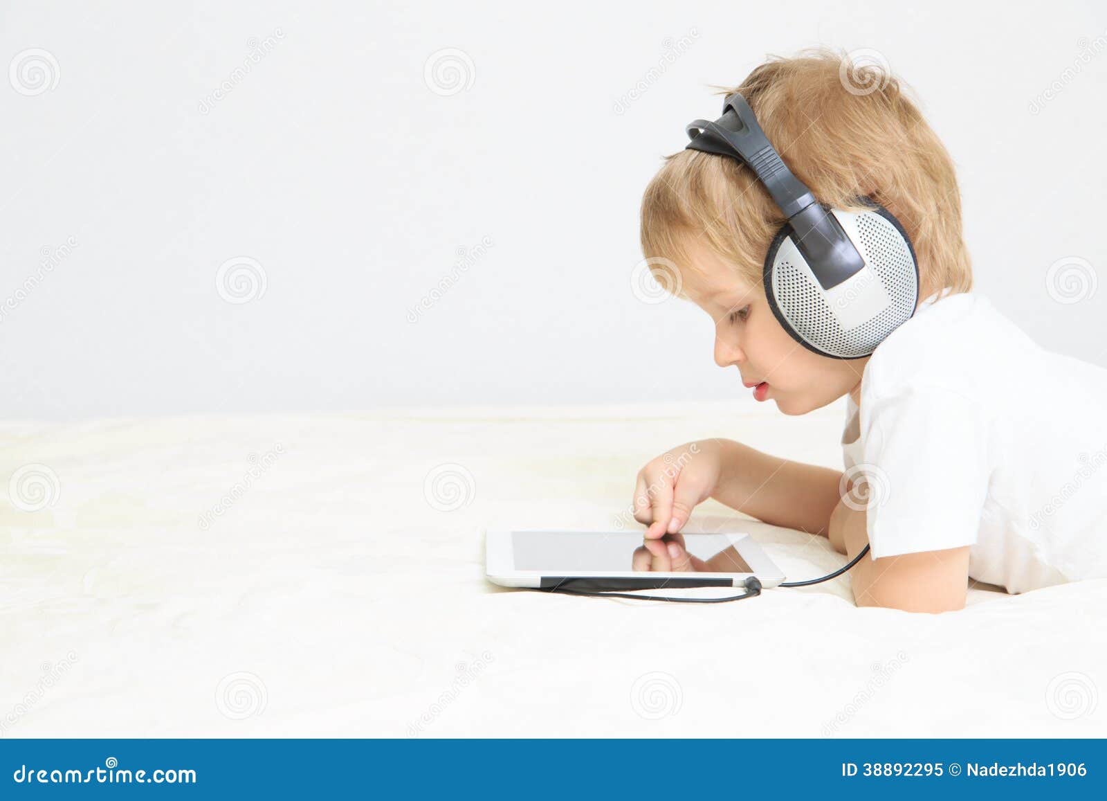 Little Boy with Headset Using Touch Pad Stock Image - Image of happy ...
