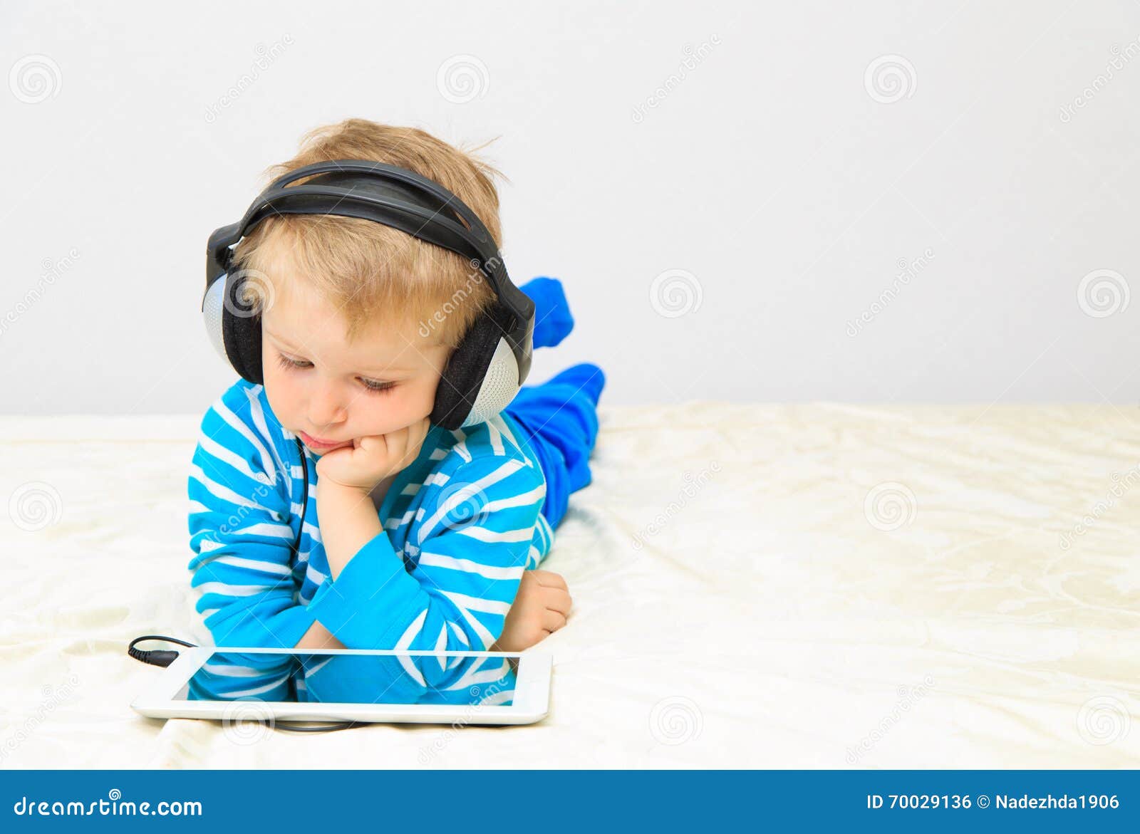 Little Boy with Headset Using Touch Pad Stock Photo - Image of ...
