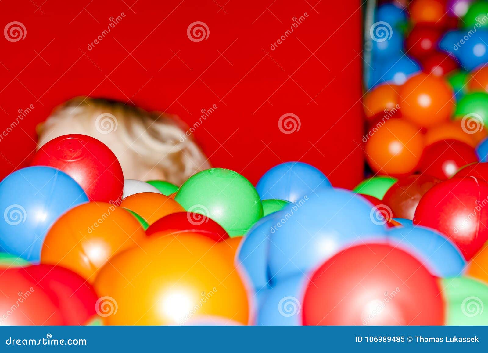 Little Boy Hiding Behind Two Plastic Balls Stock Image - Image of food ...