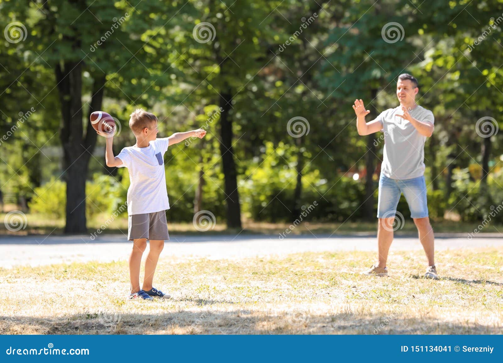 Little Boy with His Dad Playing Rugby Outdoors Stock Image - Image of ...