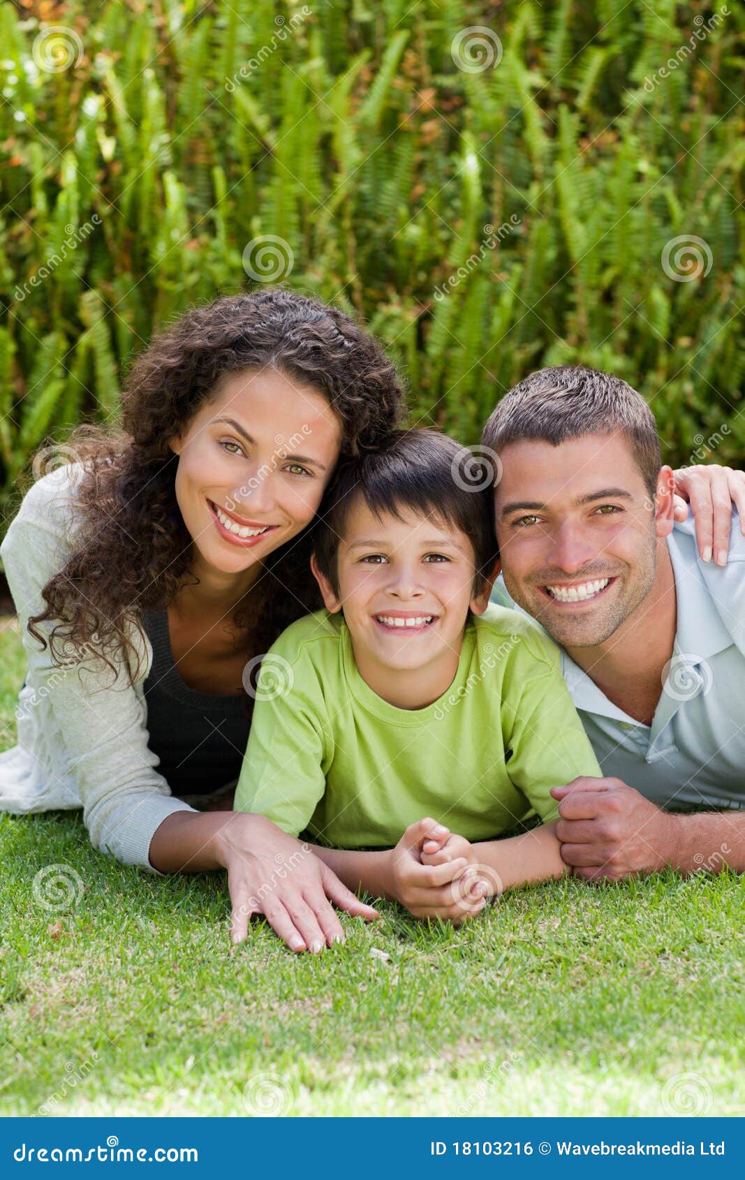 Little Boy with His Parents Lying Down Stock Photo - Image of couple ...