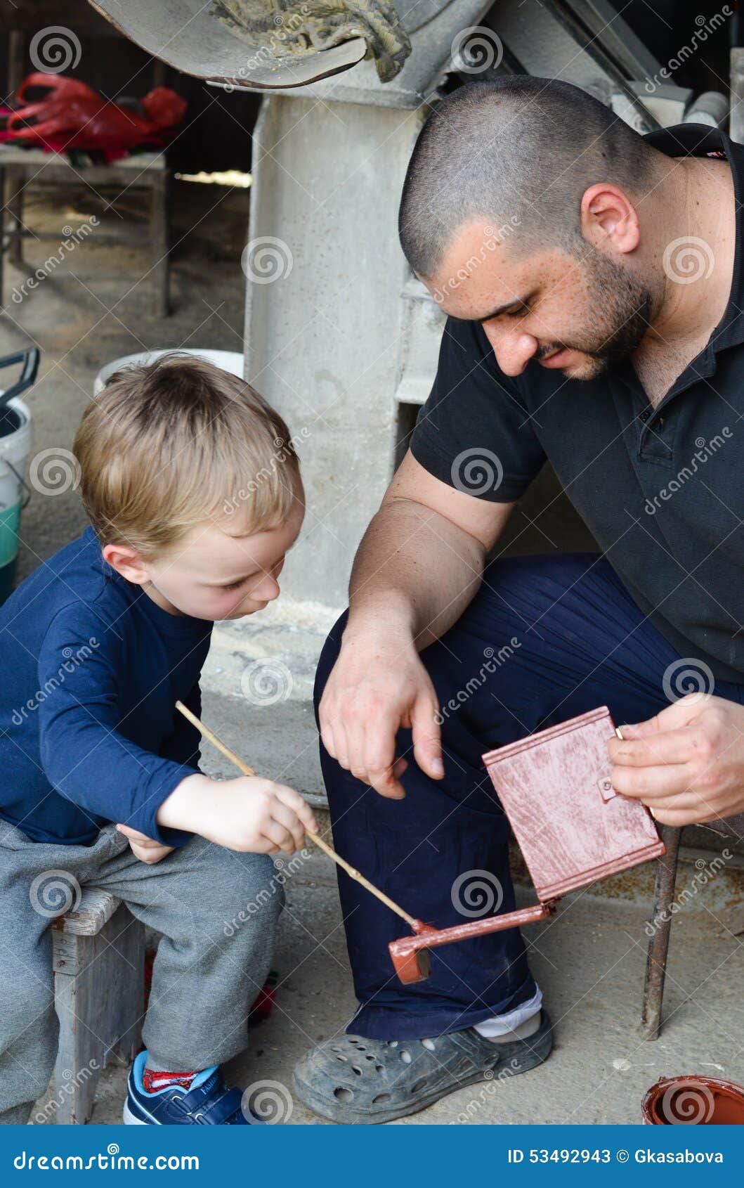 Little boy and his uncle stock image. Image of billboard - 53492943