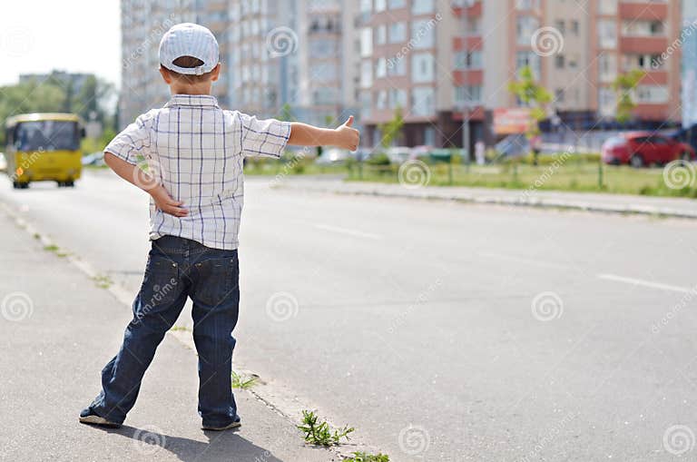 Little boy hitching a ride stock photo. Image of hiking - 25913348