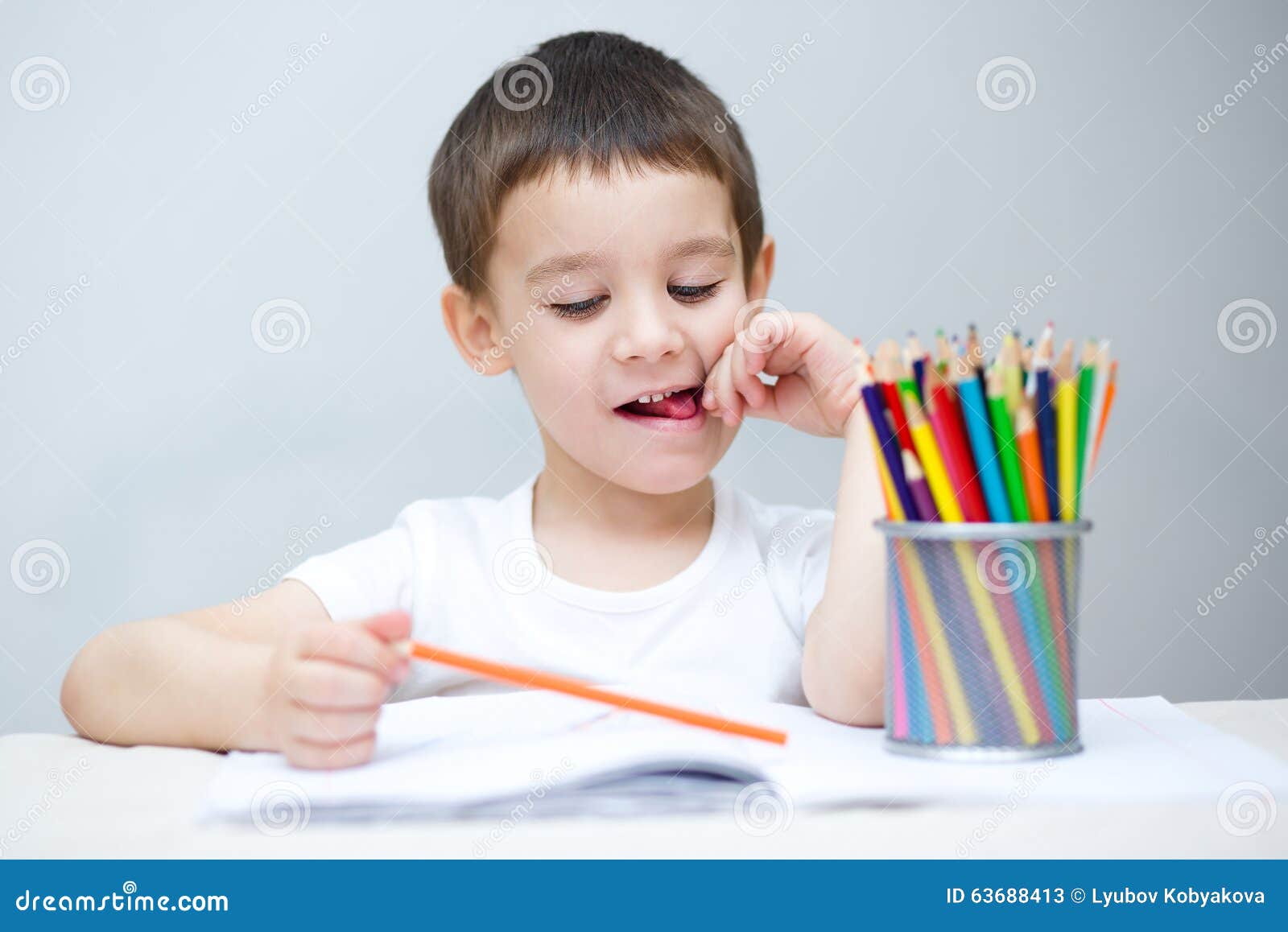 Little Boy is Holding Color Pencils Stock Image - Image of focused ...