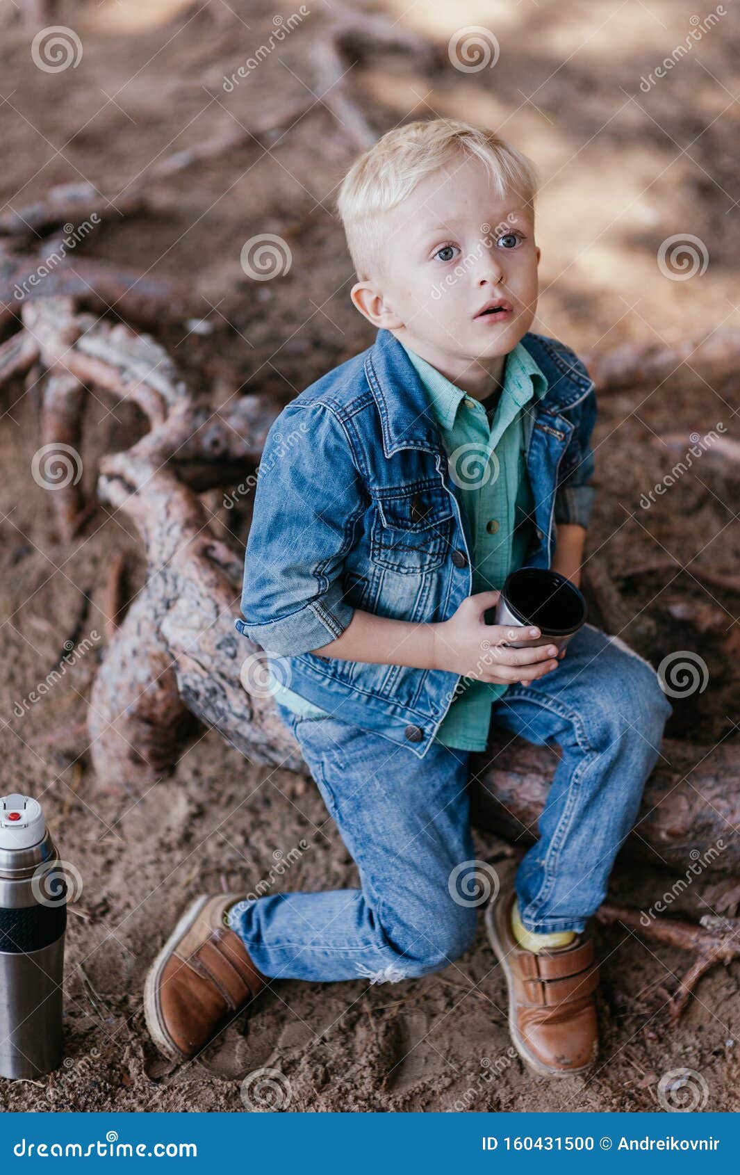 Little Boy Holding a Cup of Tea Outdoors. Child Drinks Tea Stock Photo ...