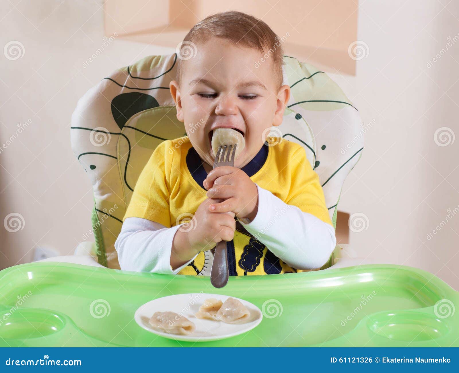 The Little Boy is Holding a Fork and Eats Itself Stock Photo - Image of ...