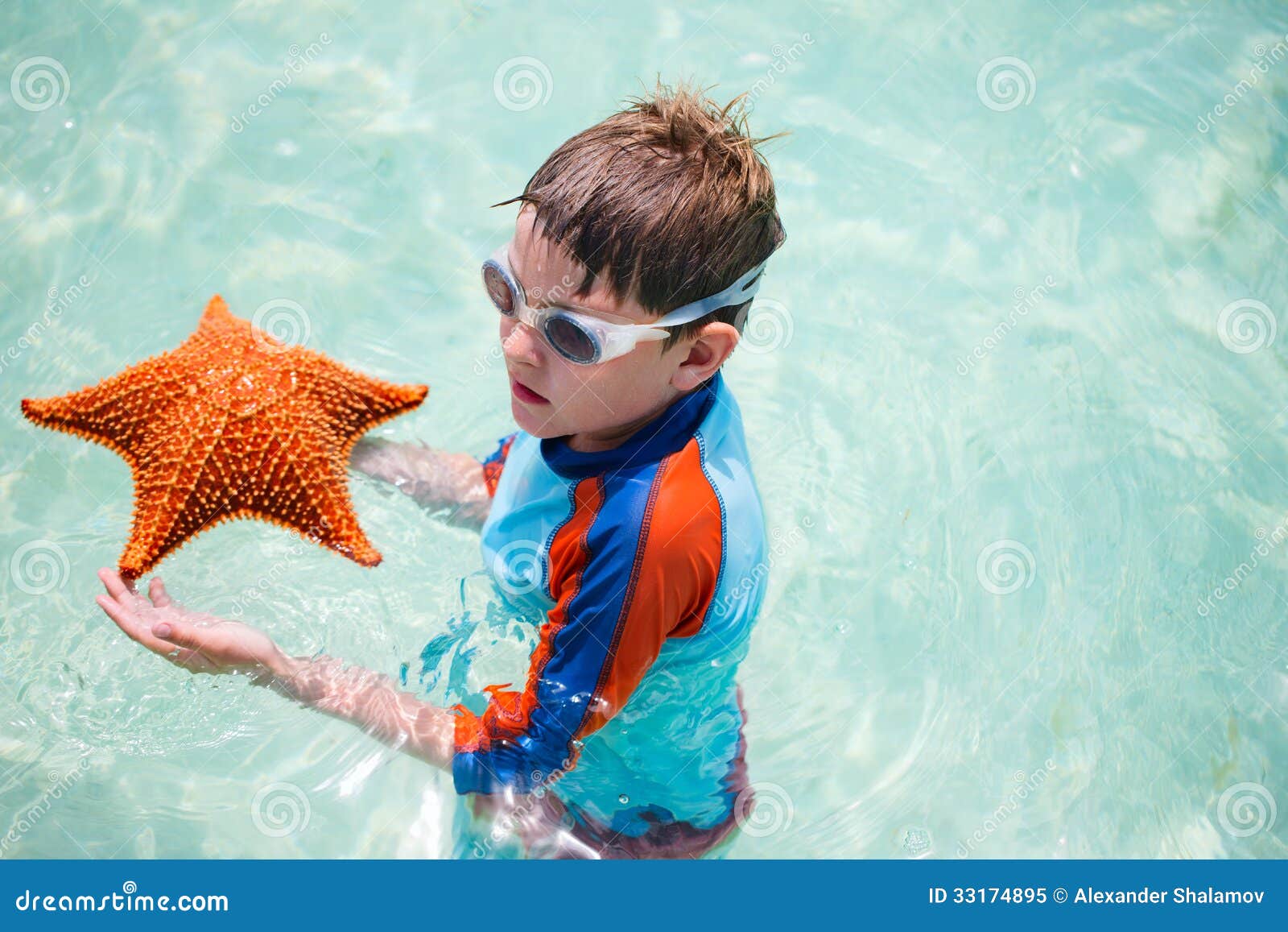 Little Boy Holding a Giant Starfish Stock Image - Image of tropical ...