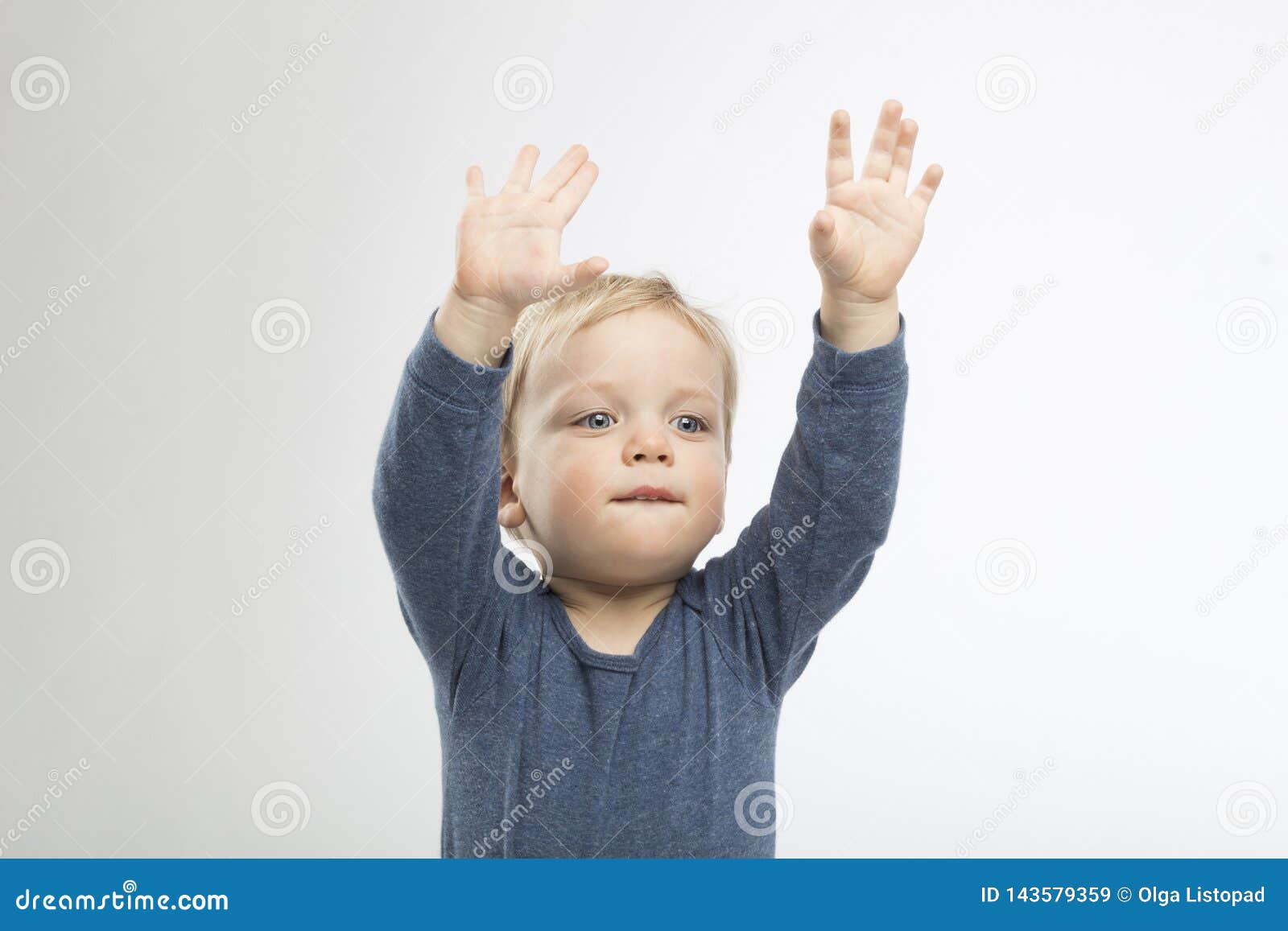 Little Boy Holding His Hands Up in the Air. Studio Shot Stock Image ...