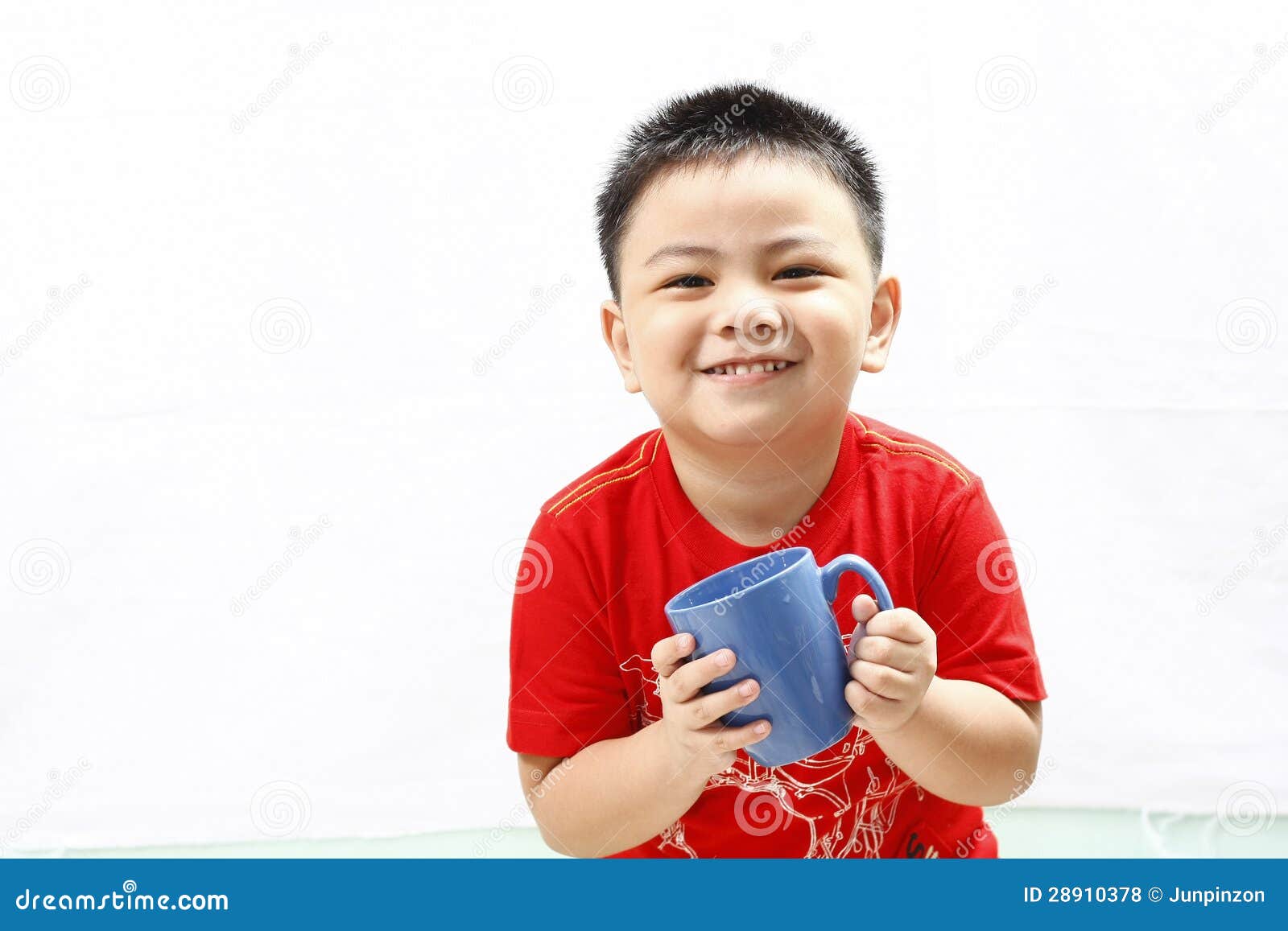 Little Boy Holding a Mug stock photo. Image of asian - 28910378
