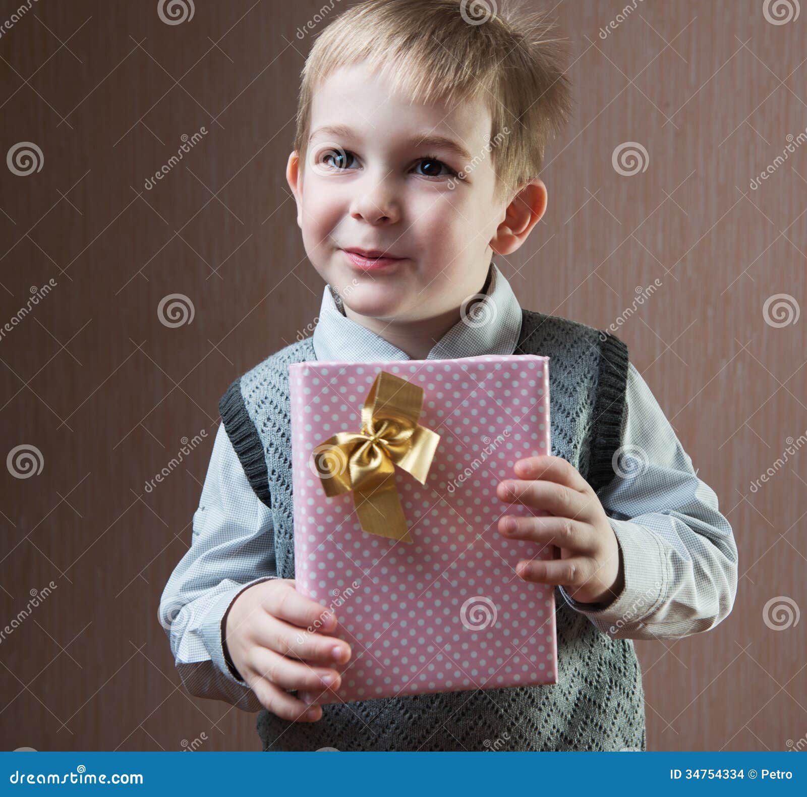 Little boy holding present stock photo. Image of handsome - 34754334