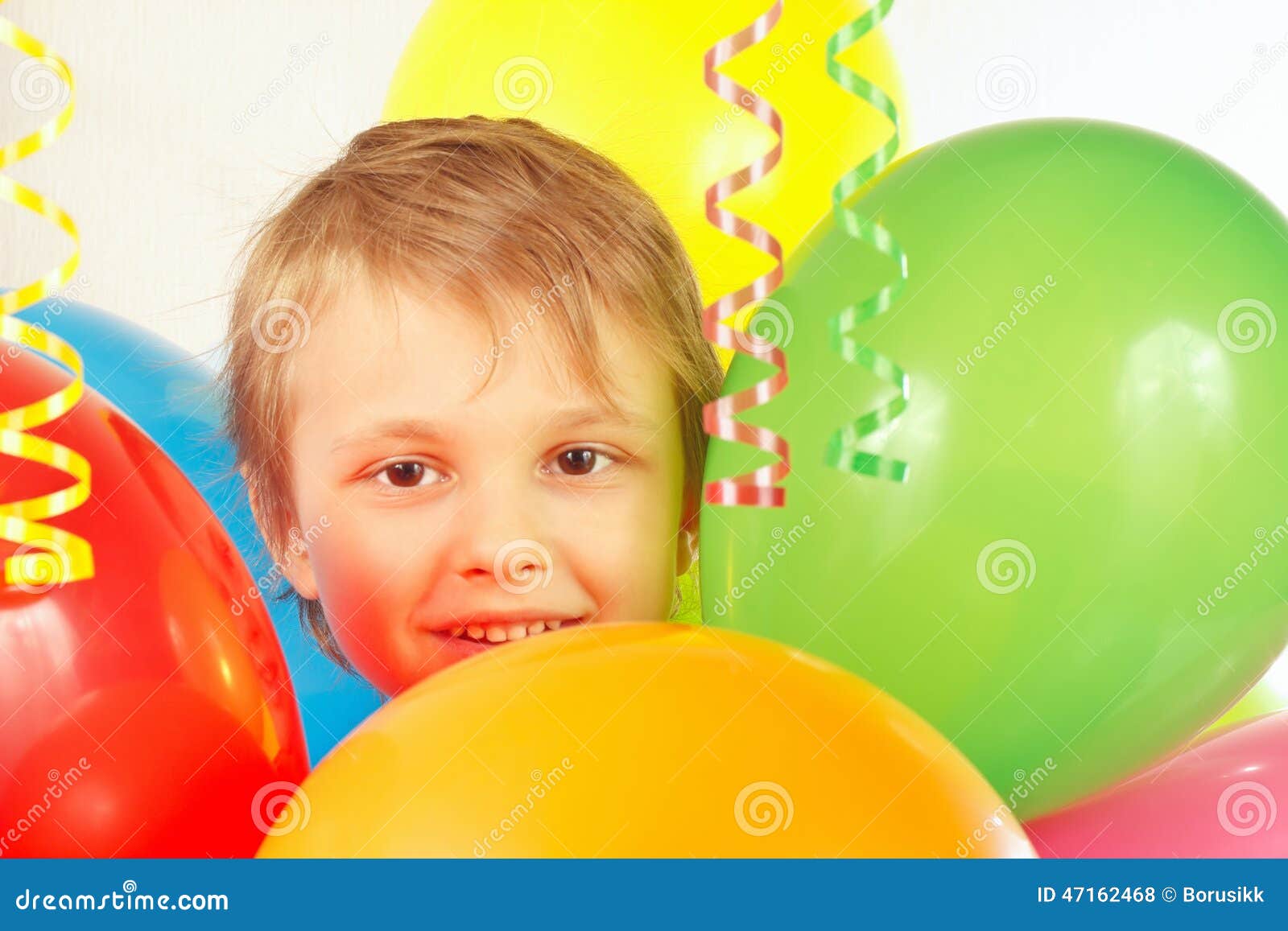 Little Boy with Holiday Balloons and Streamer Stock Photo - Image of ...
