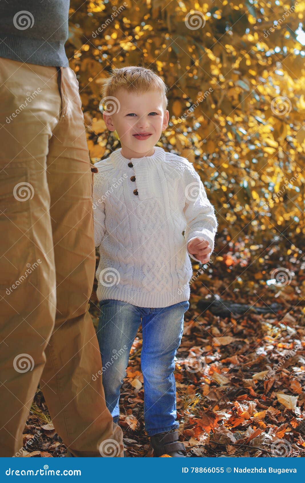Little boy hugging the leg stock image. Image of family - 78866055
