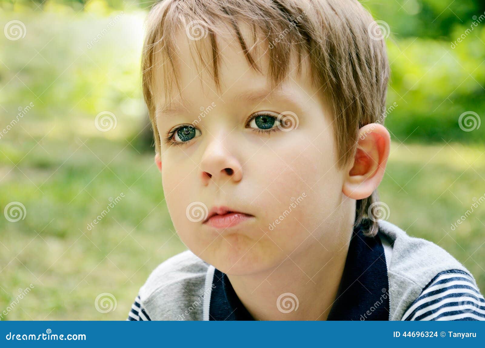 Little Boy Indifferently Looking Away Stock Photo - Image of ...