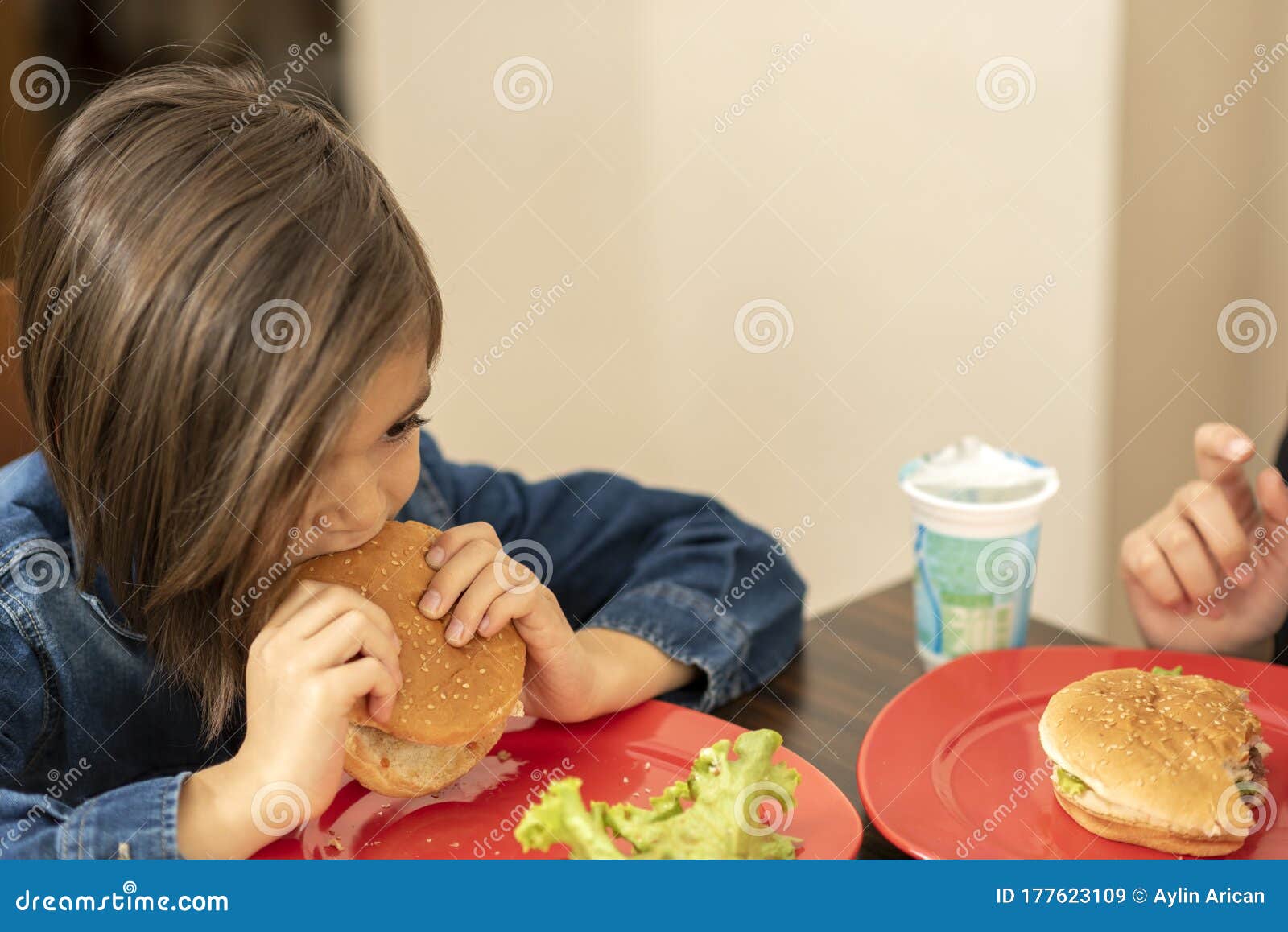 Little Boy Indoors Eating a Burger Stock Image - Image of hungry ...
