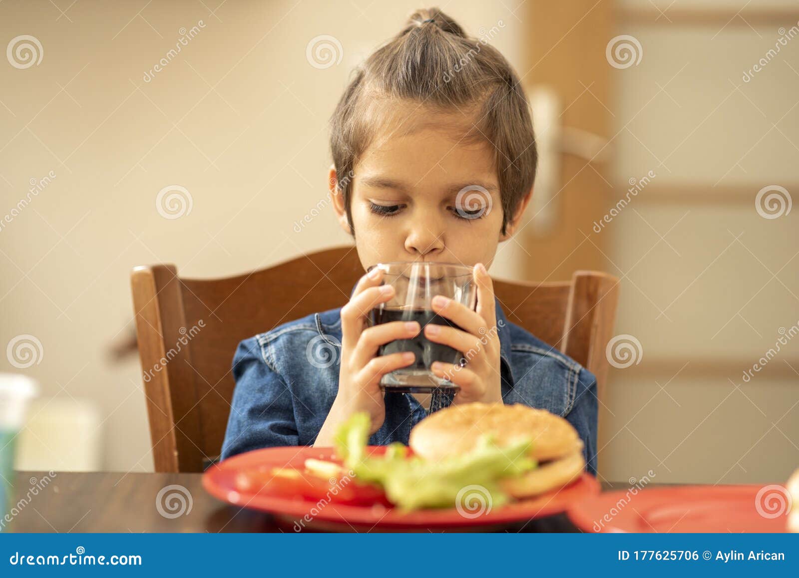 Little Boy Indoors Eating a Burger Stock Photo - Image of domestic ...
