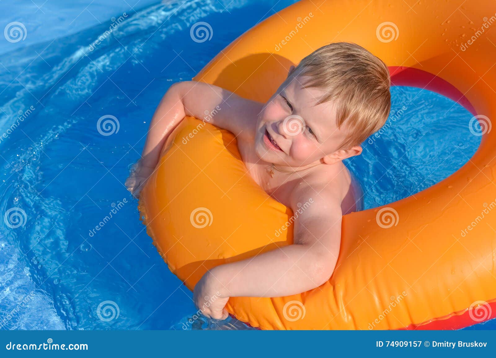 Little Boy on an Inflatable Circle in the Water Stock Image - Image of ...