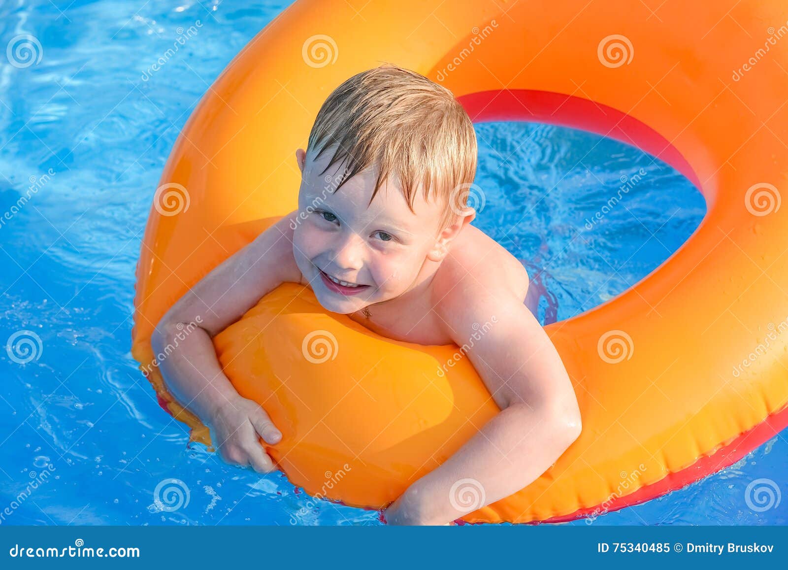 Little Boy on an Inflatable Circle in the Water Stock Image - Image of ...