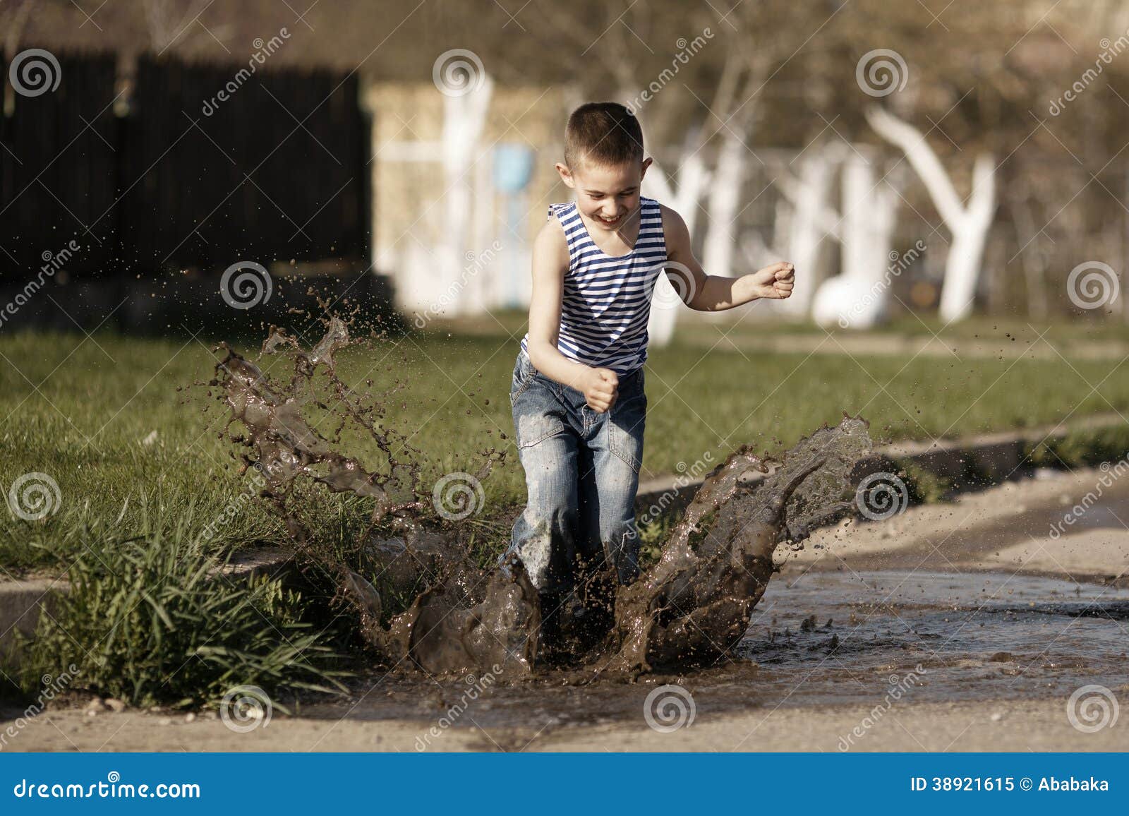 Little Boy Jumping in Puddle Stock Image - Image of splash, funny: 38921615