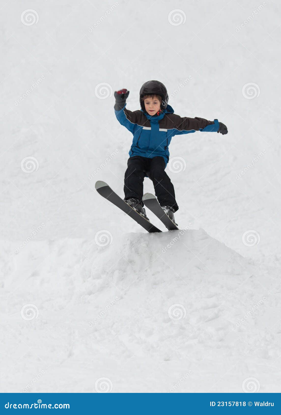 Little Boy Jumping on Snow Skis Stock Photo - Image of action, jump ...