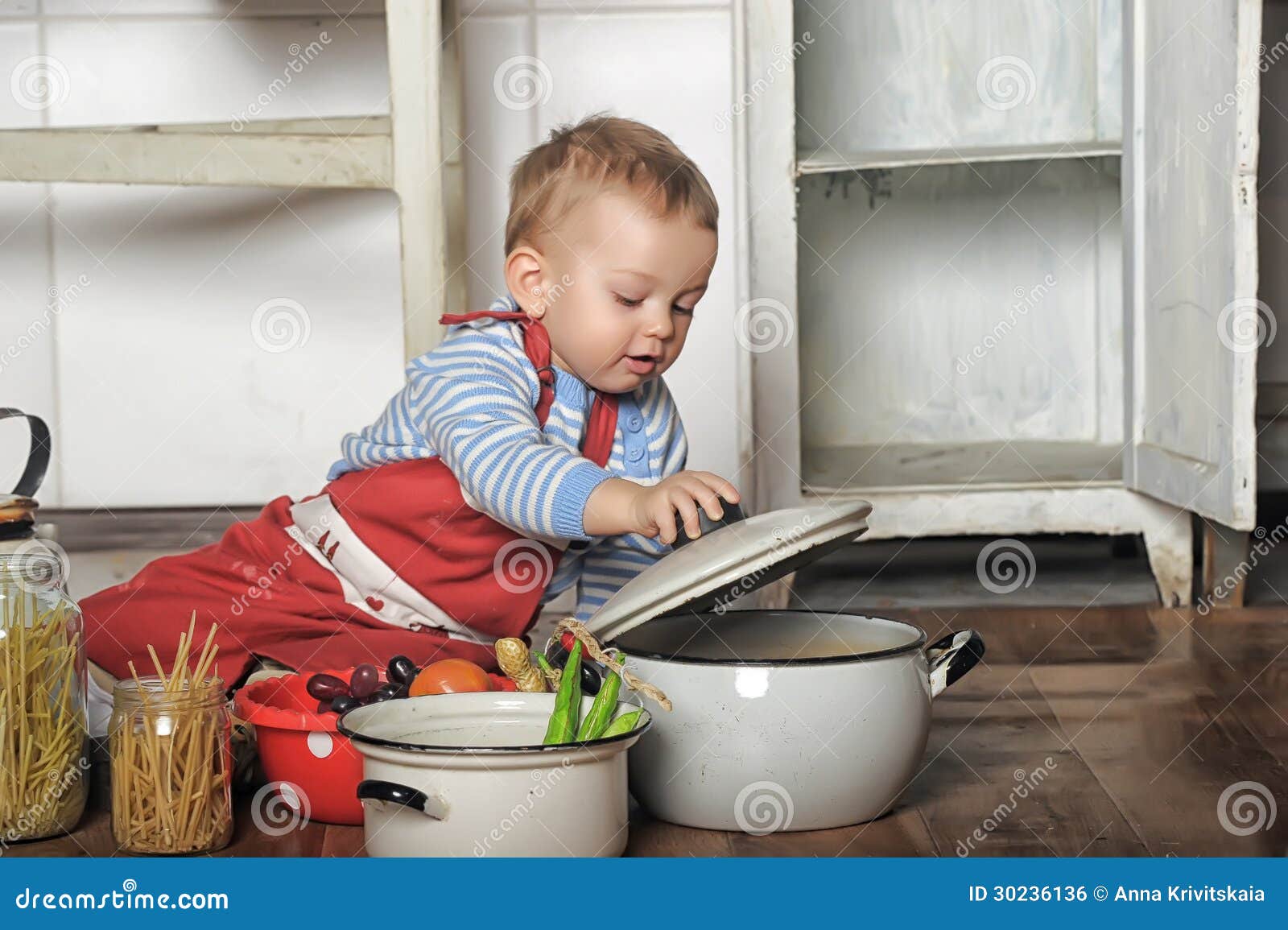 Little boy in the kitchen stock photo. Image of born - 30236136
