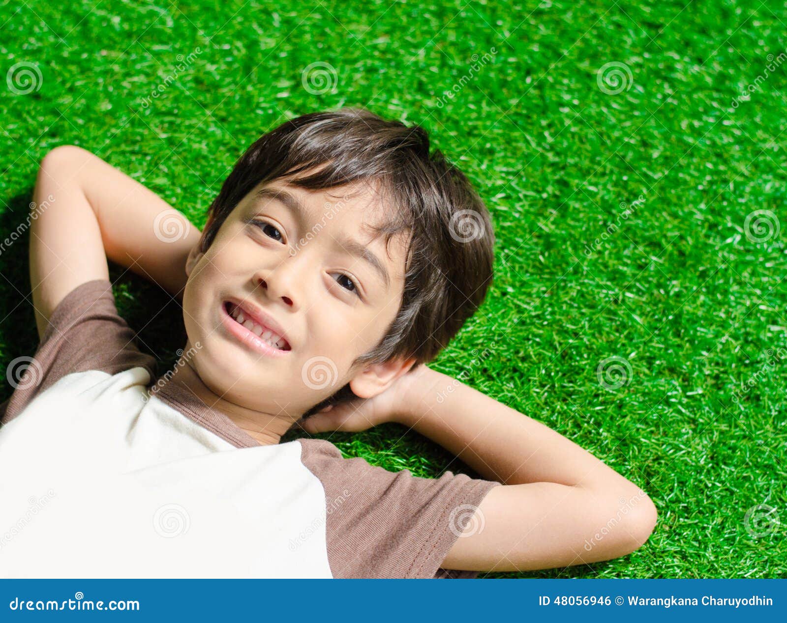 Little Boy Lay Down on Green Grass Stock Photo - Image of portrait ...