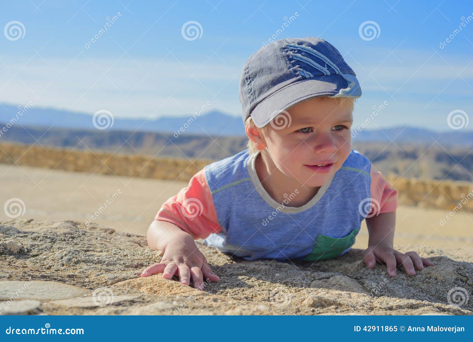 Little Boy Laying Down on the Rock Stock Image - Image of playing ...