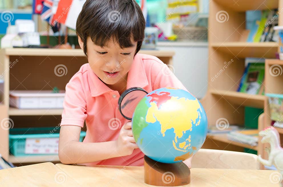 Little Boy Learning Map in Classroom Stock Image - Image of smile, blue ...