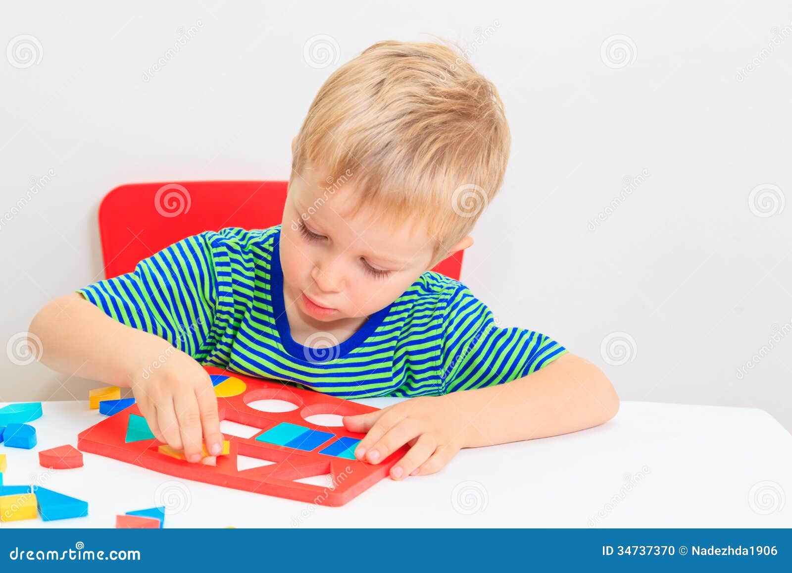 Little boy learning shapes stock photo. Image of objects - 34737370