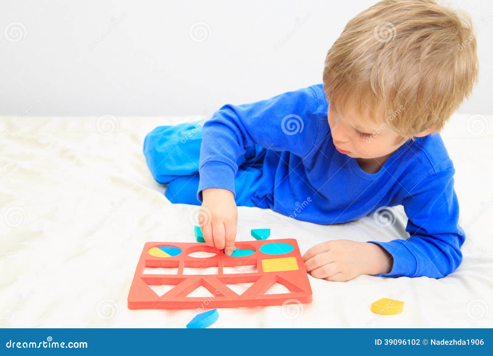 Little boy learning shapes stock photo. Image of occupied - 39096102