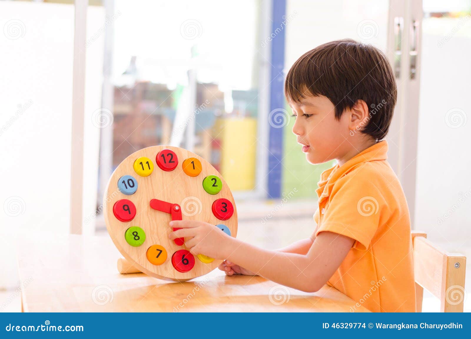 Little Boy Learning Time with Clock Toy of Montessori Educational ...