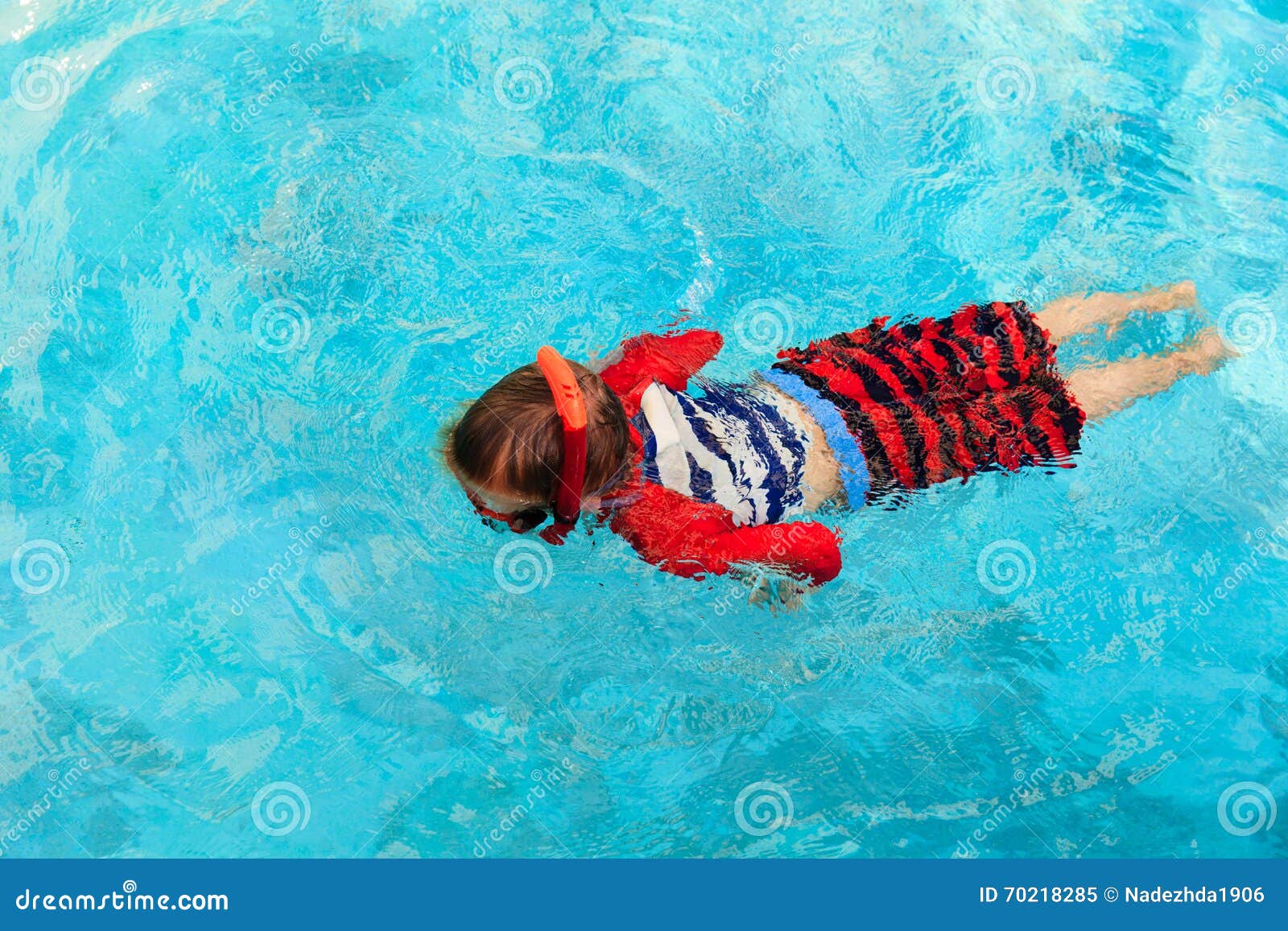 Little Boy Learns Swimming Alone in the Pool Stock Image - Image of ...