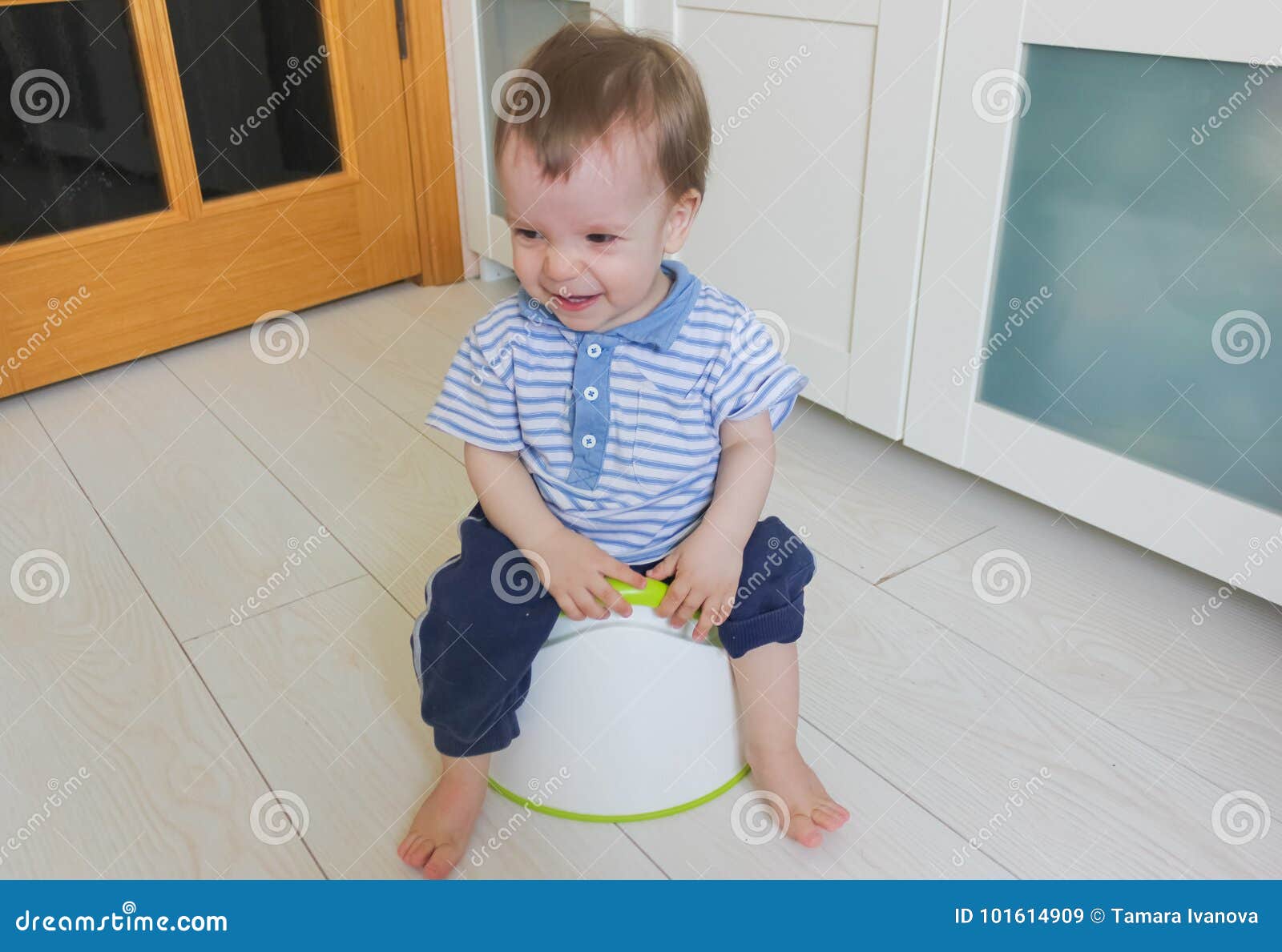 A Little Boy Learns To Go Potty. Accustom the Child To the Potty Stock ...