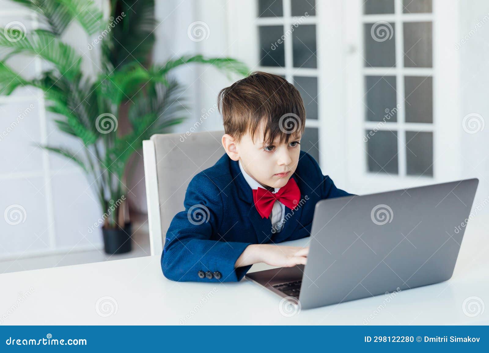 Little Boy Learns To Work on a Laptop Stock Photo - Image of happy ...