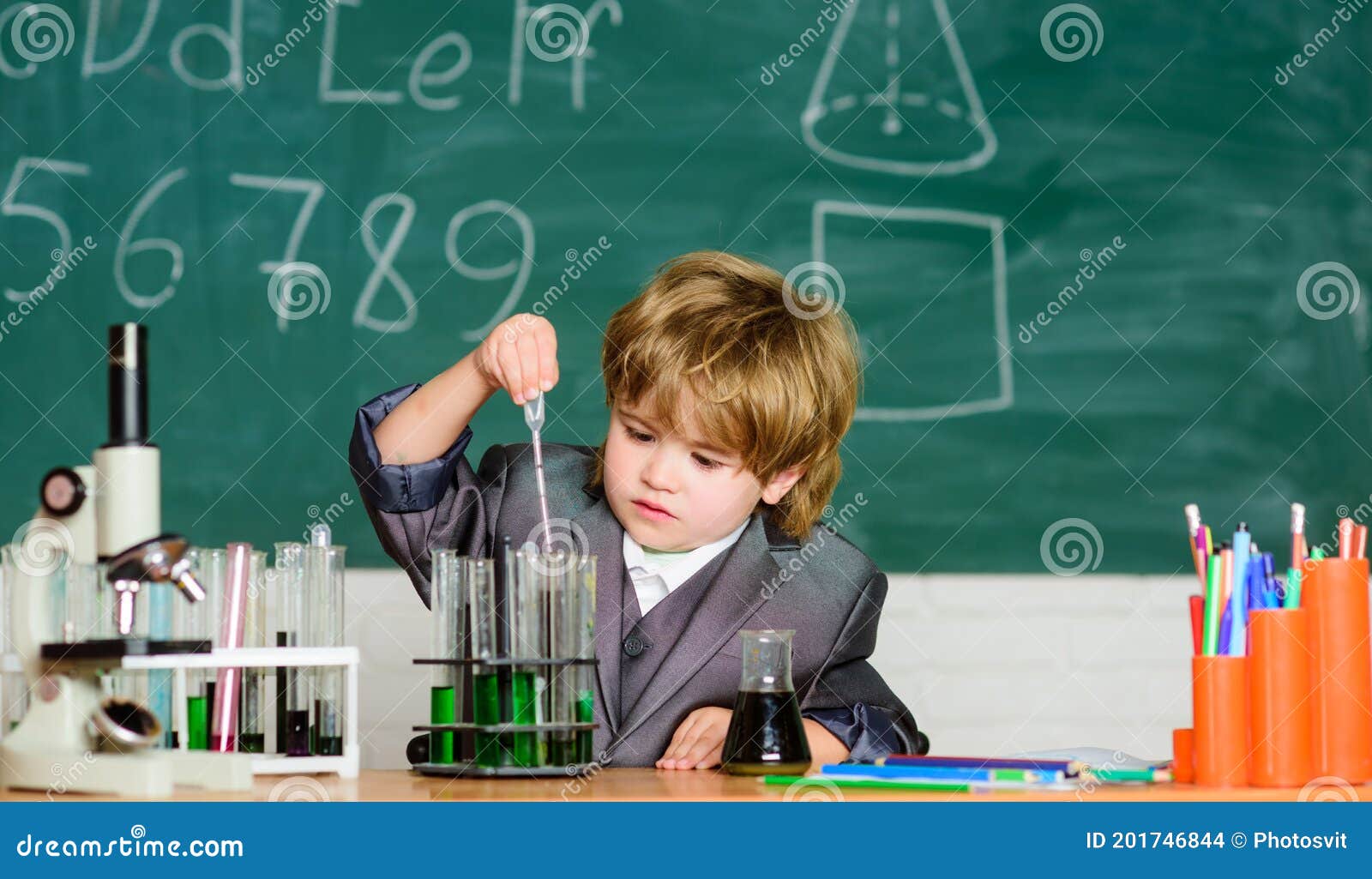 Little Boy at Lesson. Back To School. Little Boy is Making Science ...