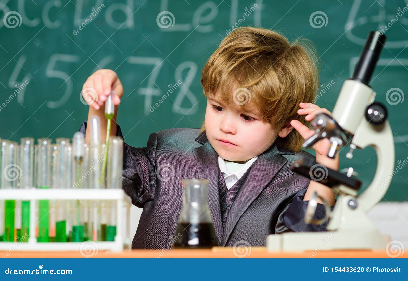 Little Boy at Lesson. Back To School. Little Boy is Making Science ...