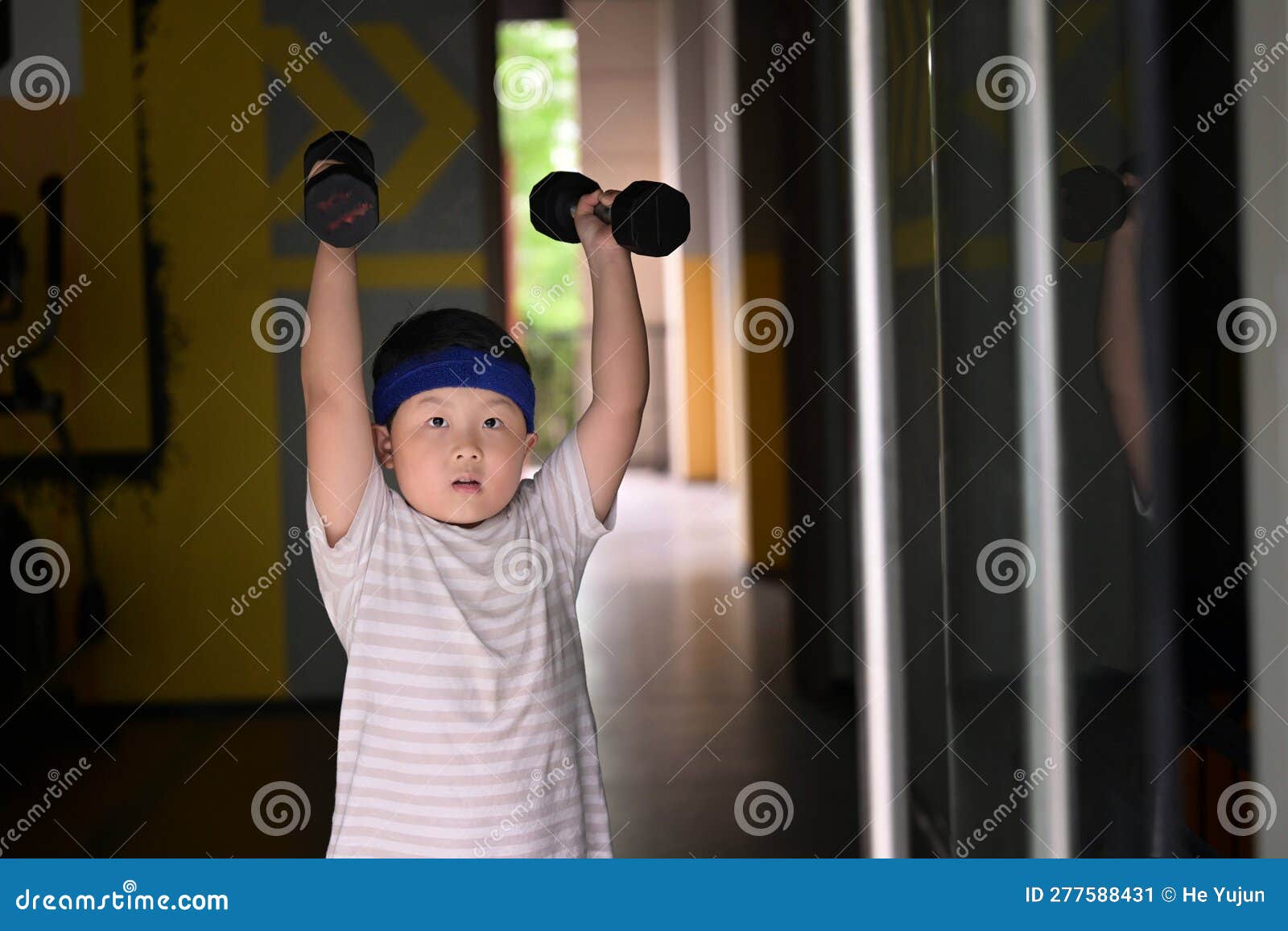 Little Boy is Lifting Dumbbells in the Gym Stock Image - Image of ...
