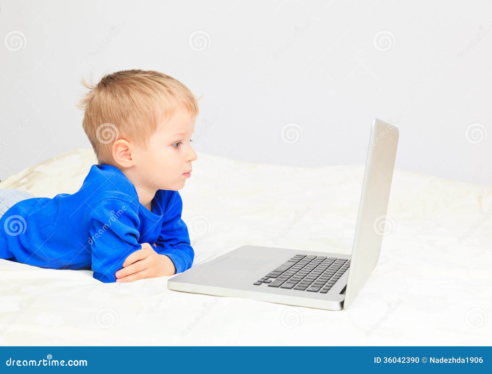 Little Boy Looking at Computer Stock Photo - Image of contemporary ...