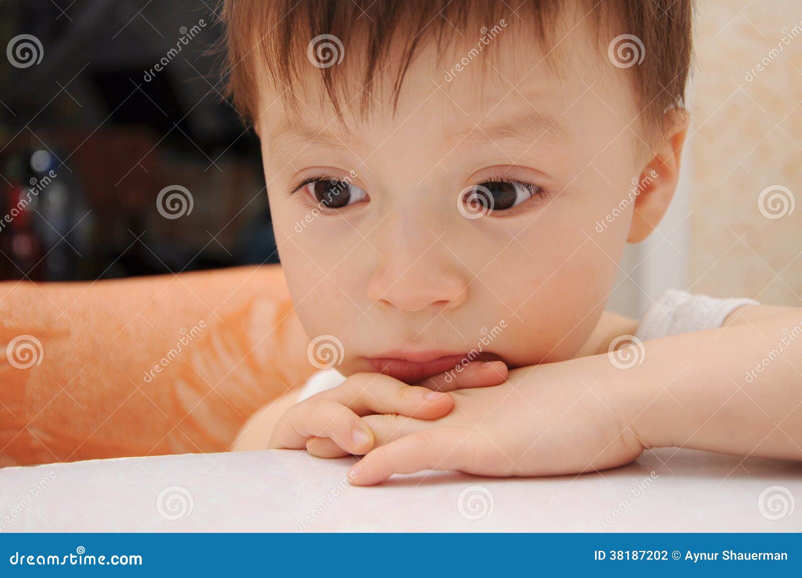 Little boy looking down stock photo. Image of sadness - 38187202