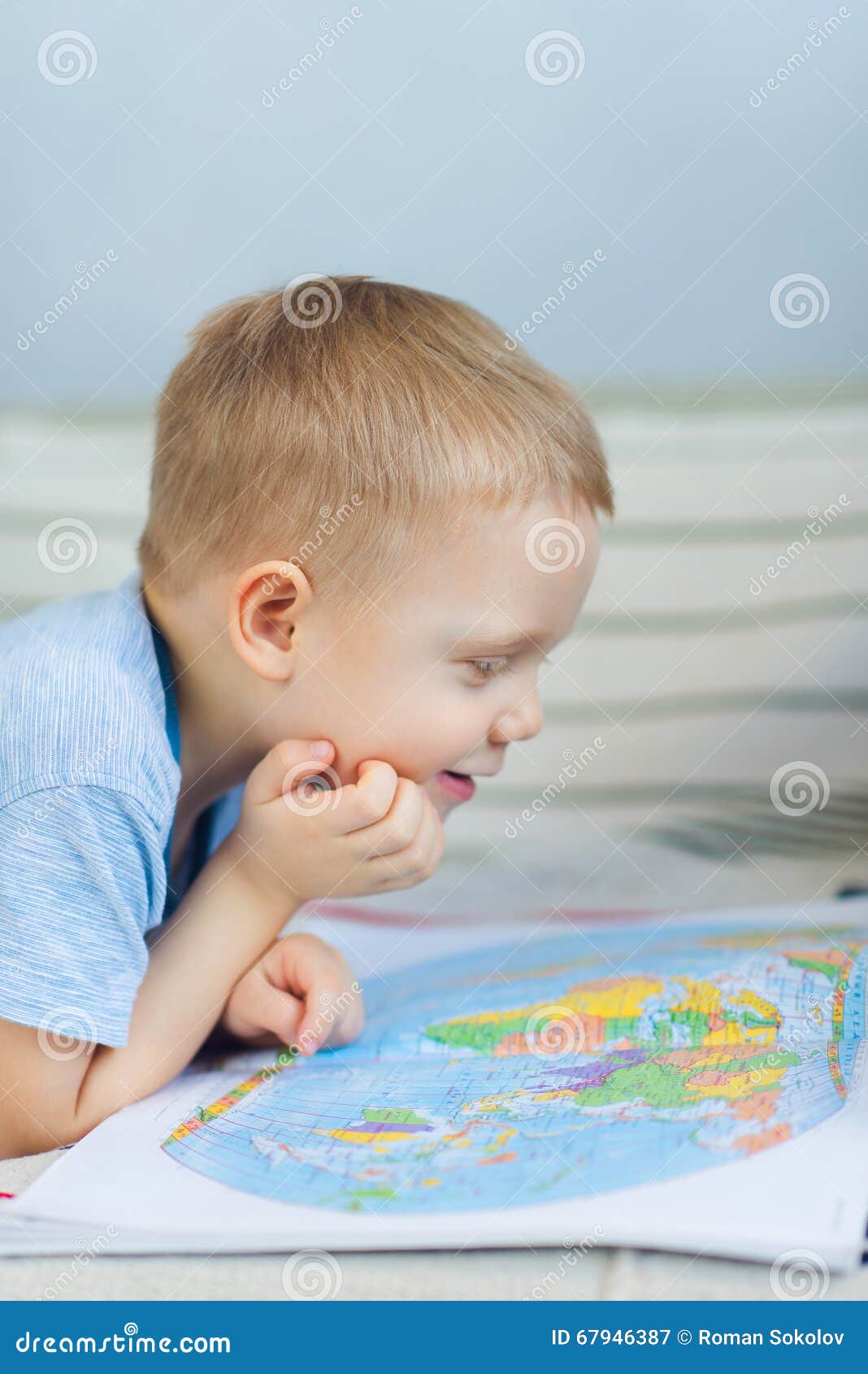 Little boy looking at map stock image. Image of home - 67946387