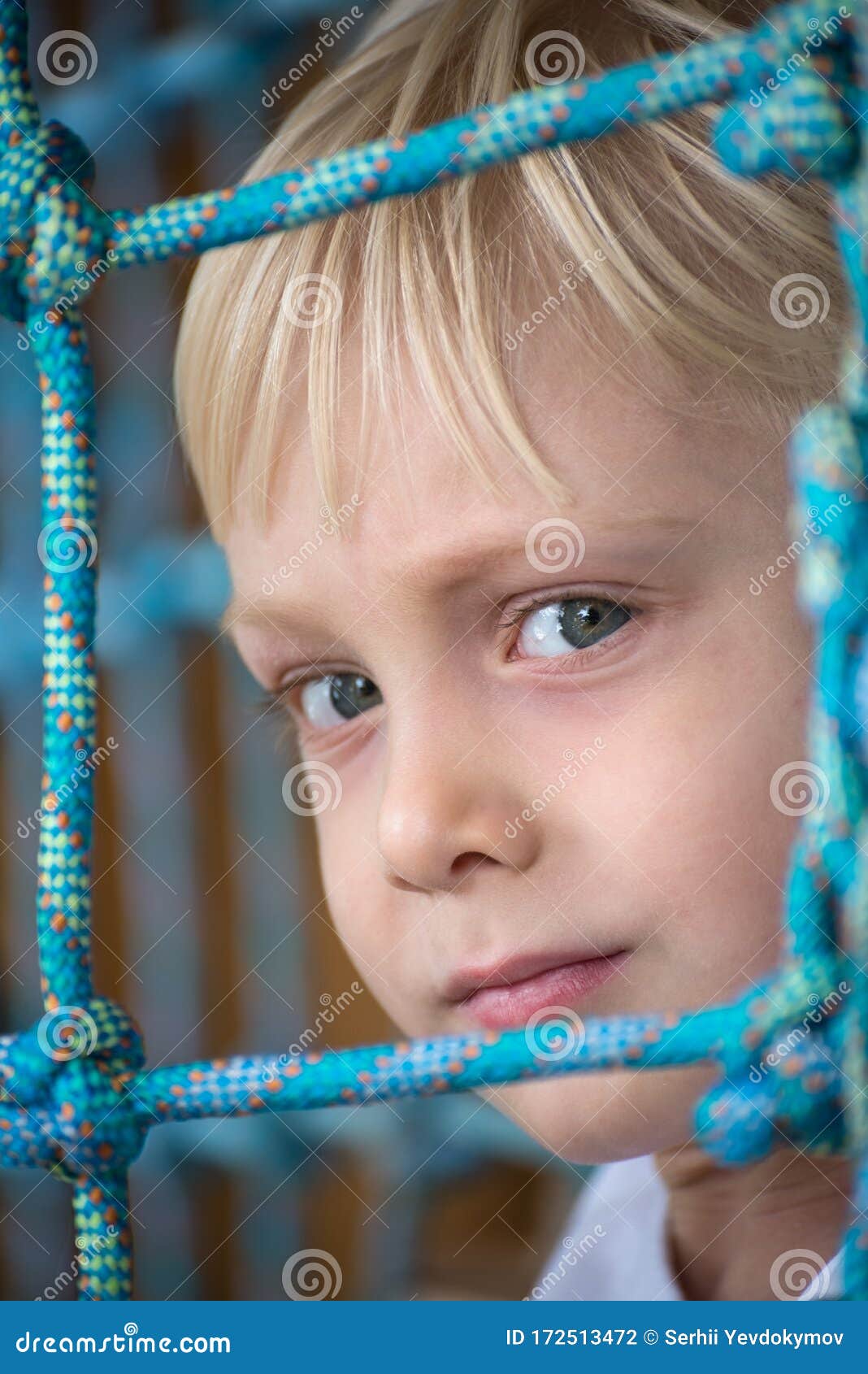 Little Boy Looks Thoughtfully at the Camera. Child Looks through the ...