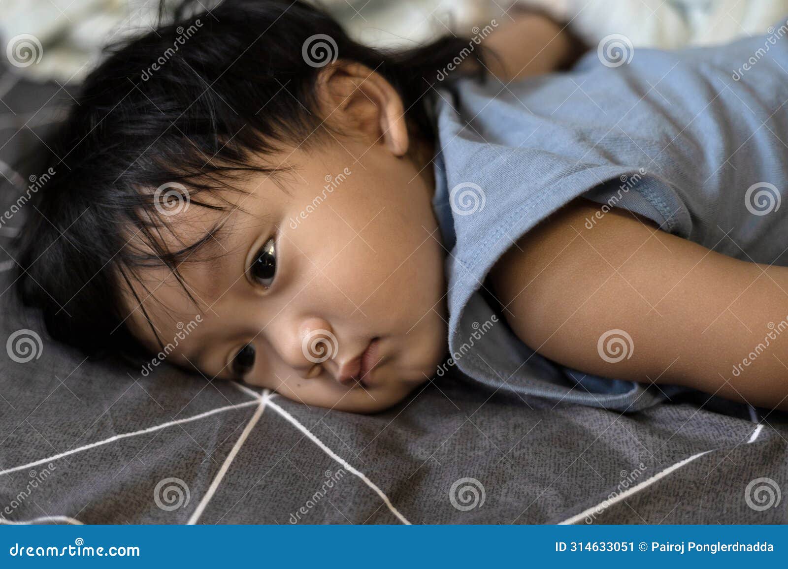 Little Boy Lying Down on the Bed Stock Image - Image of asia ...