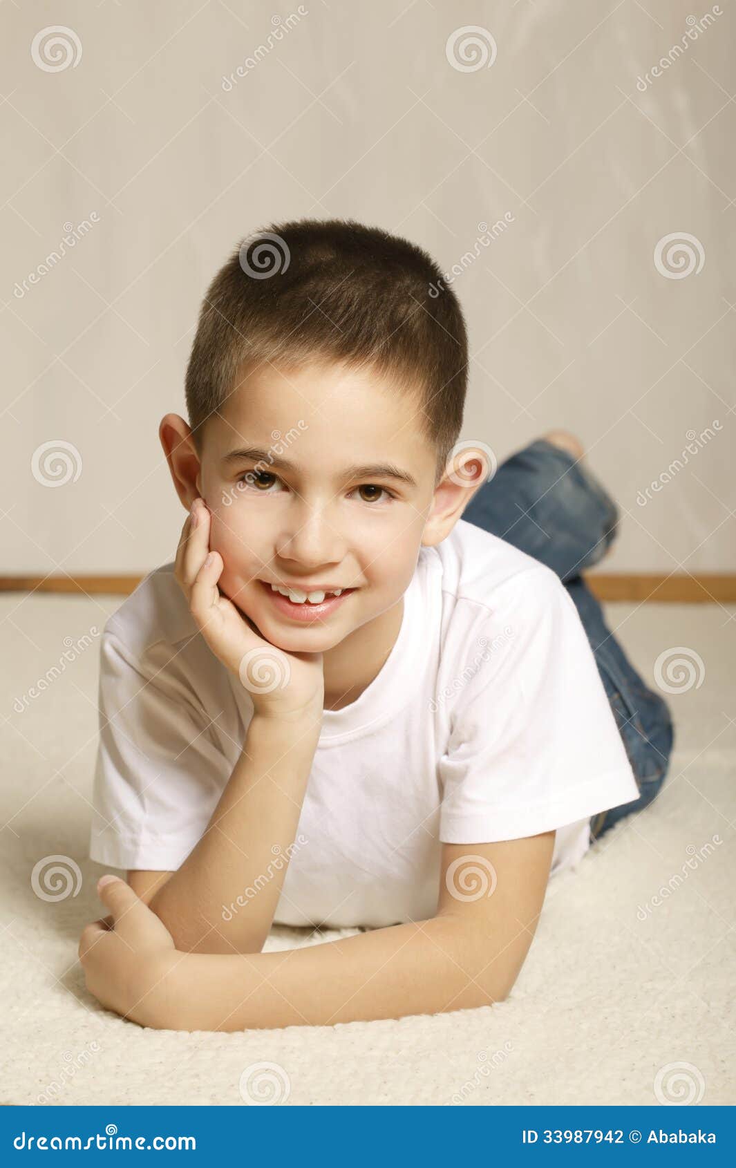 Little boy lying on floor stock photo. Image of positive - 33987942