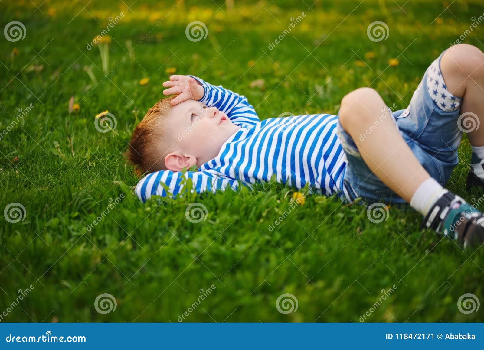 Little Boy Lying on the Grass Stock Image - Image of lying, portrait ...