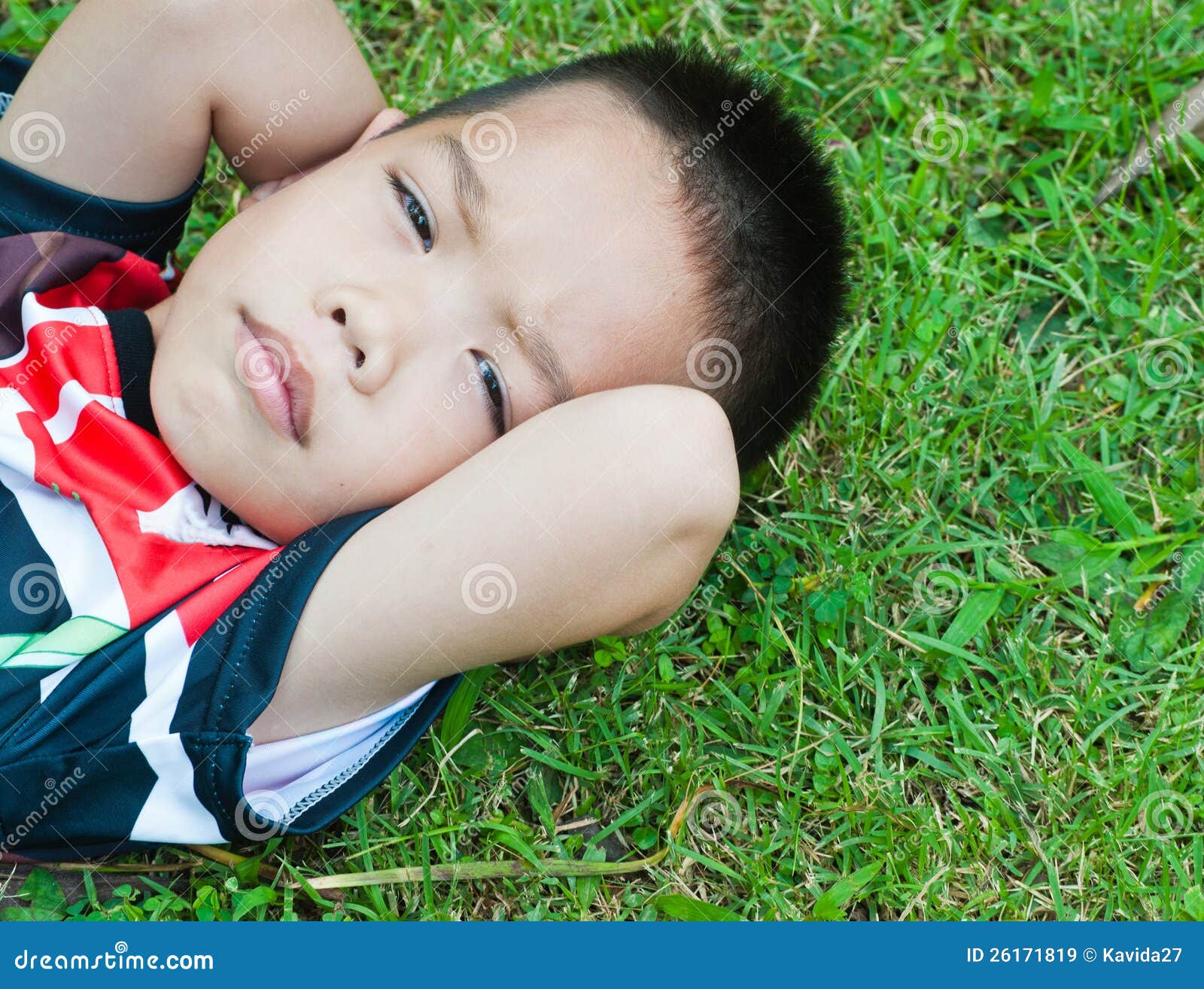 Little Boy Lying on a Green Grass Stock Image - Image of child ...